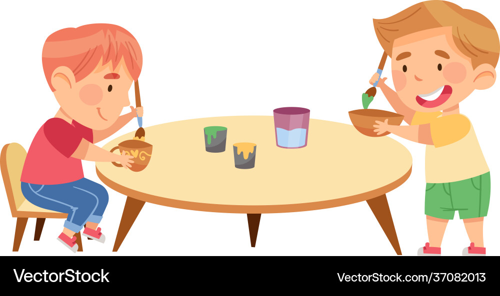 Little boys in kindergarden sitting at table Vector Image
