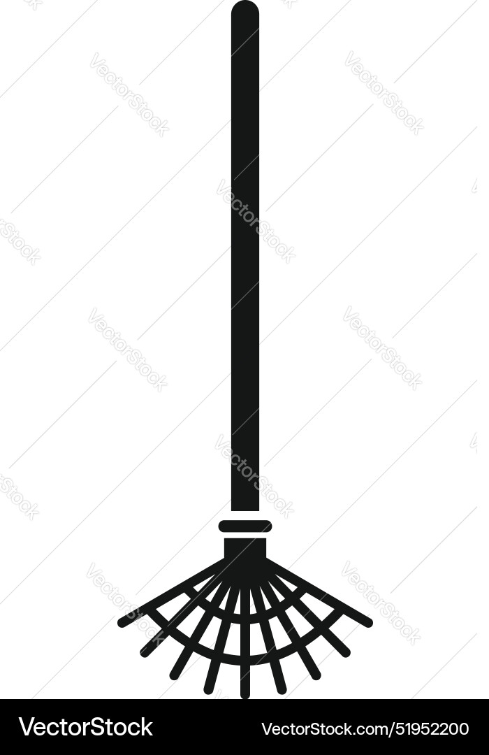 Black garden rake standing with long wooden handle