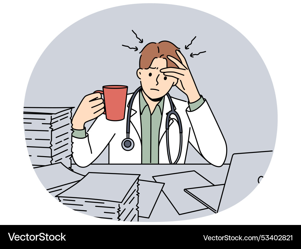 Frustrated doctor with cup of coffee sits at table