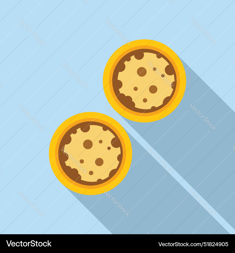 Two round cookies lying on blue background casting