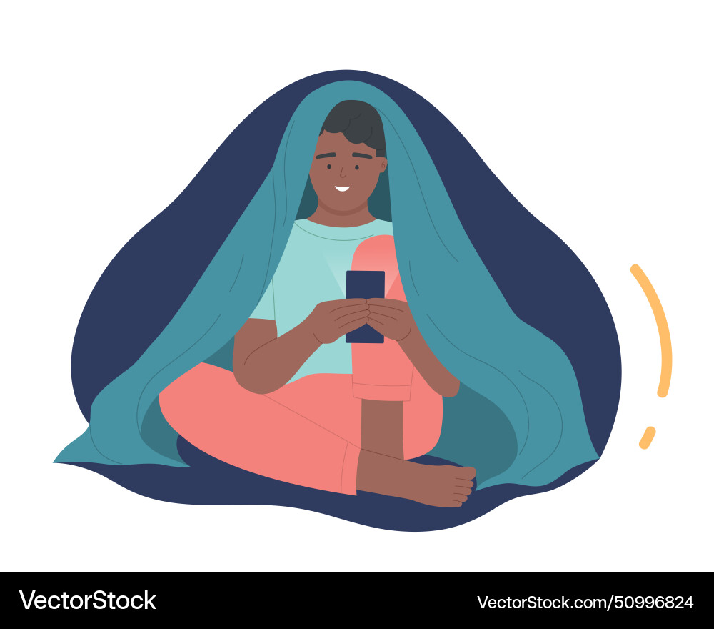 Happy boy sitting in bed under blanket holding Vector Image