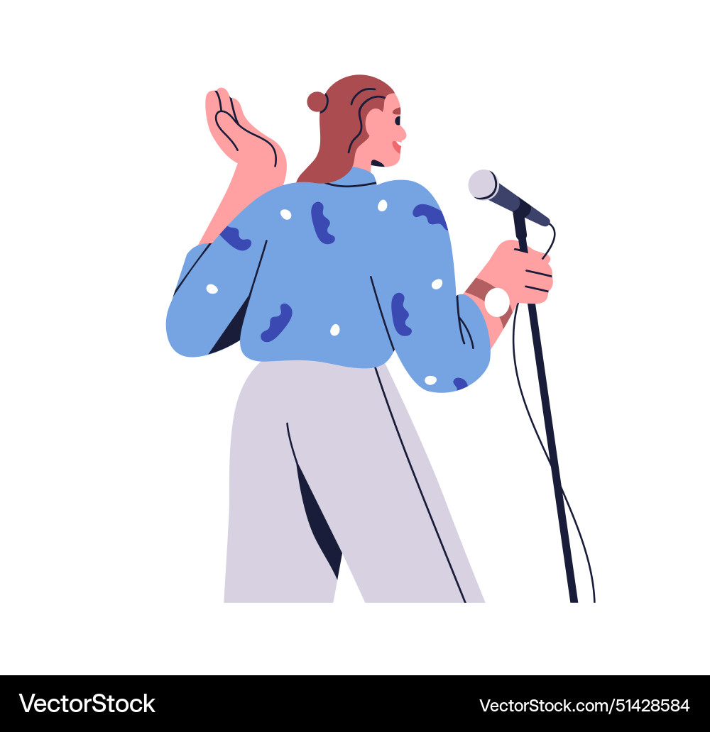 Female comedian with microphone at open mic comedy