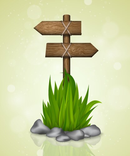 Wooden signpost surrounded by grass pointing right