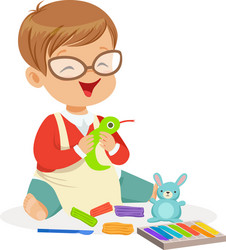 Little boy drawing a picture with color pencils Vector Image