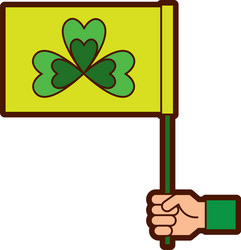 Hand holding green flag with clover symbol Vector Image