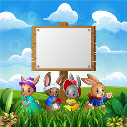 Cartoon bunny holding blank sign Royalty Free Vector Image