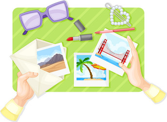 Hand opening envelope with picture card depicting Vector Image