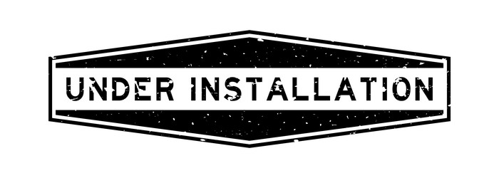 Grunge red under installation word hexagon rubber Vector Image