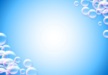 Soap bubbles abstract blue background with rainbow