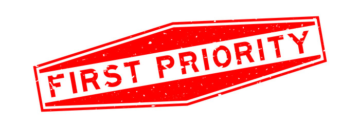 Grunge blue first priority word hexagon rubber Vector Image