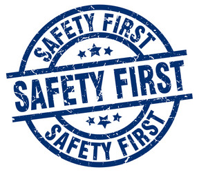 Safety first stamp safety first label round Vector Image