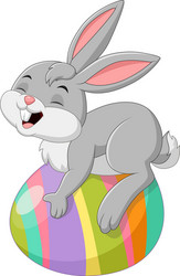 Cartoon little rabbit holding easter egg Vector Image