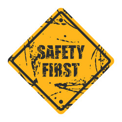 Industrial worker holding safety first sign Vector Image