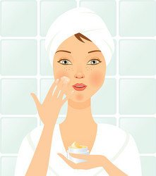 Portrait of a girl uses a cosmetic facial cream Vector Image