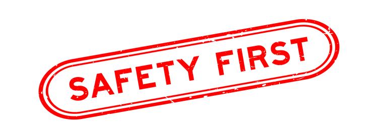 Grunge green safety first word rubber seal stamp Vector Image