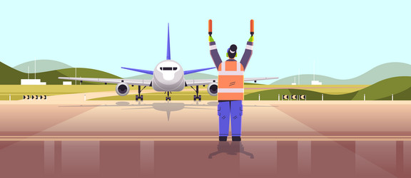 Aviation marshaller with light sticks near Vector Image