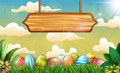 Decorated easter eggs and board blank sign in a fa