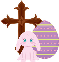 Cute rabbit with catholic cross and eggs of easter