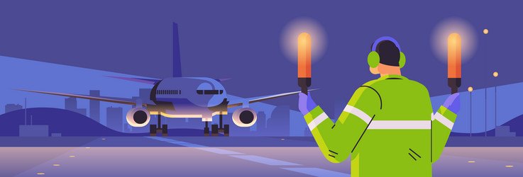 Aviation marshaller with light sticks near Vector Image