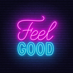 Good vibes neon lettering on brick wall background