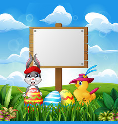 Cartoon bunny holding blank sign Royalty Free Vector Image