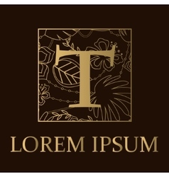 T gold letter with swirly ornaments Royalty Free Vector