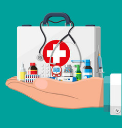 First aid kit with medical equipment Royalty Free Vector