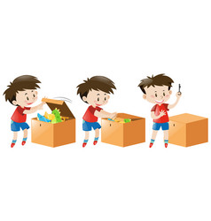 Cute boy sitting on floor and cleaning up his toys